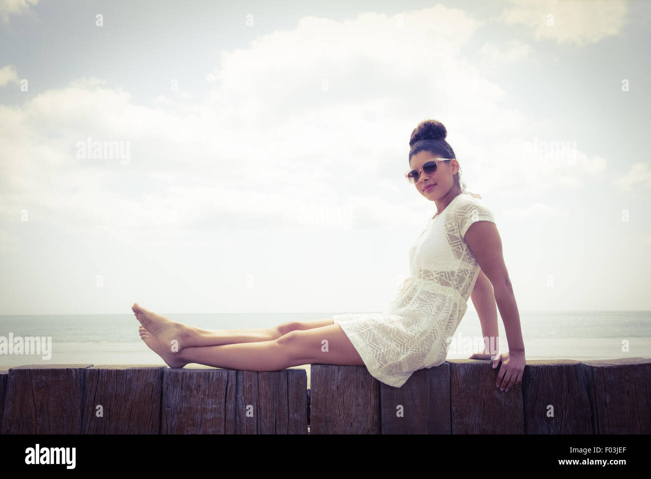 Pretty woman in sun dress Stock Photo - Alamy