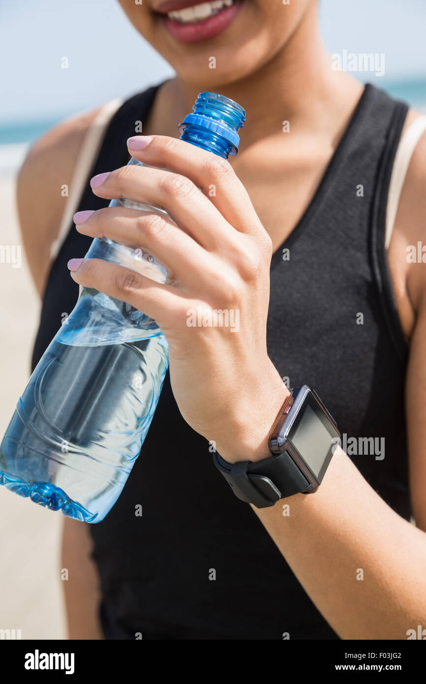 Fit woman wearing smart watch Stock Photo - Alamy