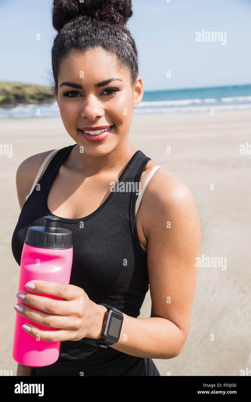 Fit woman wearing smart watch Stock Photo - Alamy