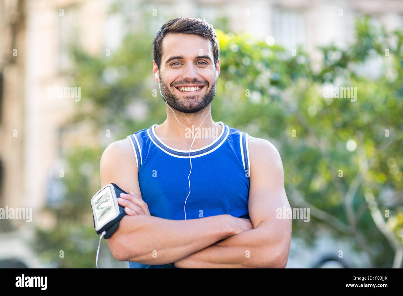 Portrait of an happy handsome athlete Stock Photo - Alamy