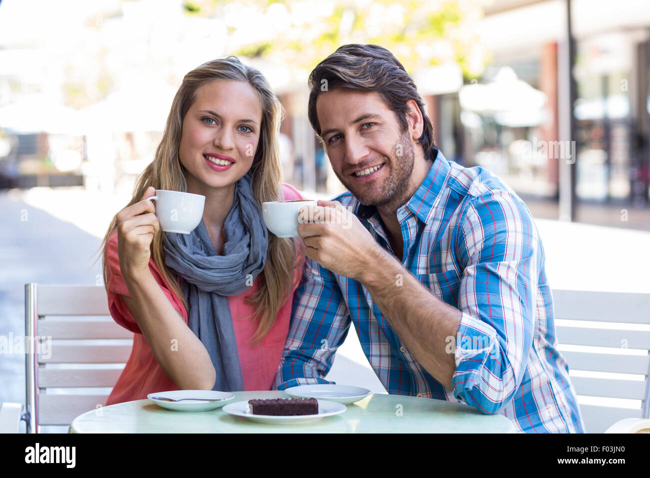 Cute couple having coffee together Stock Photo - Alamy