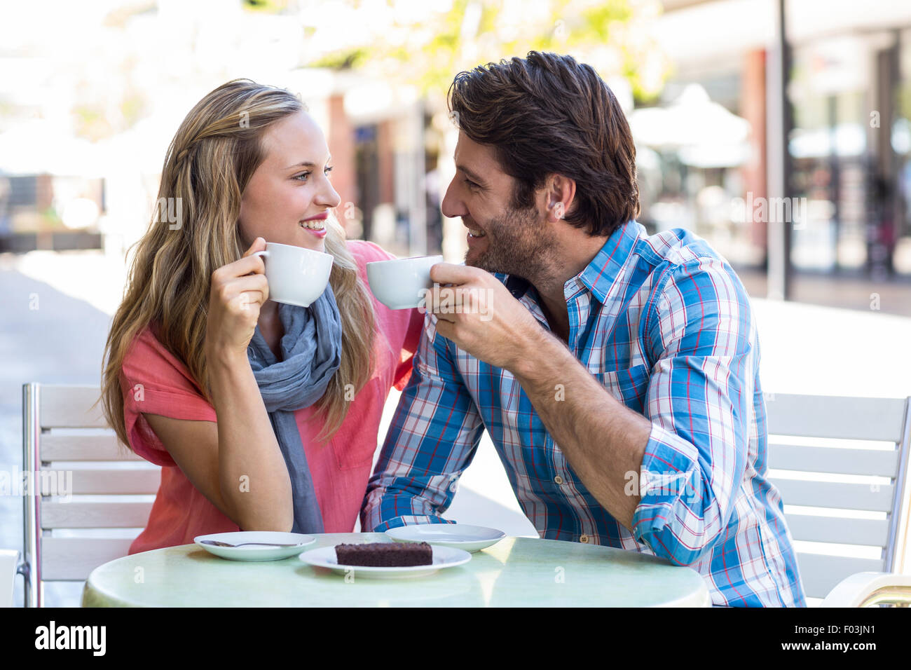 Cute couple having coffee together Stock Photo - Alamy