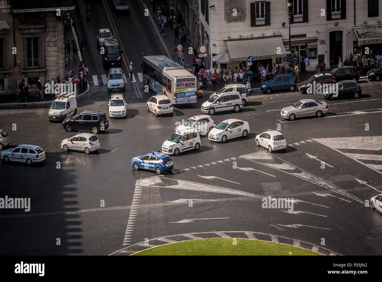 Busy chaotic traffic at roundabout intersection on Rome road Stock ...