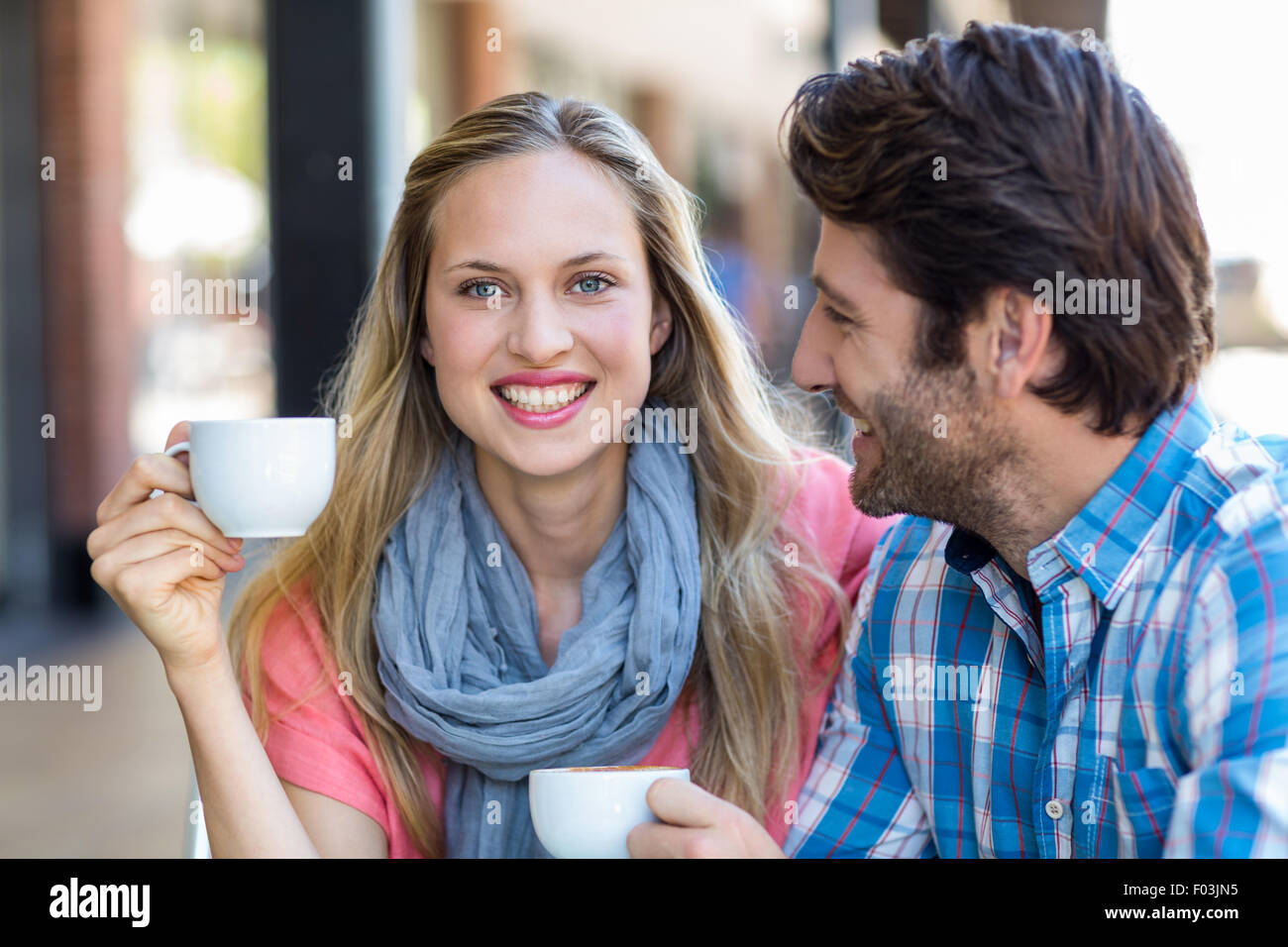 Cute couple having coffee together Stock Photo - Alamy