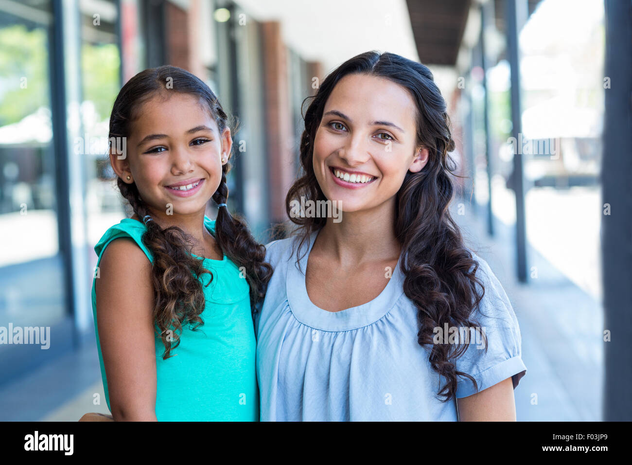 Portrait of a mother and her daughter smiling Stock Photo - Alamy