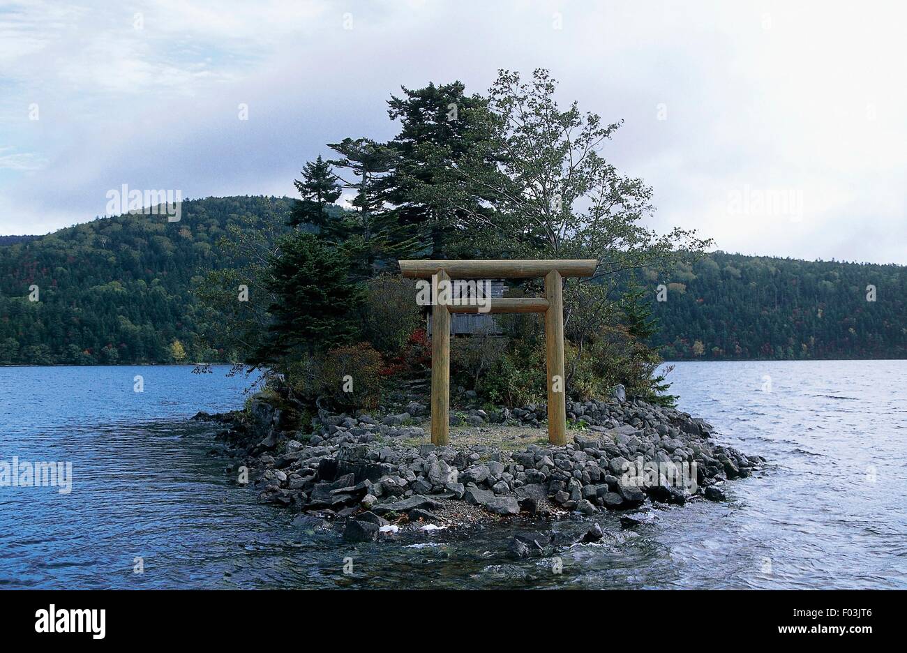 Torii (Shinto shrine portal) in wood on a small island, Lake ...