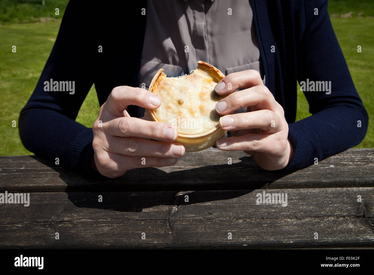 Women eating Scotch Pie Stock Photo - Alamy