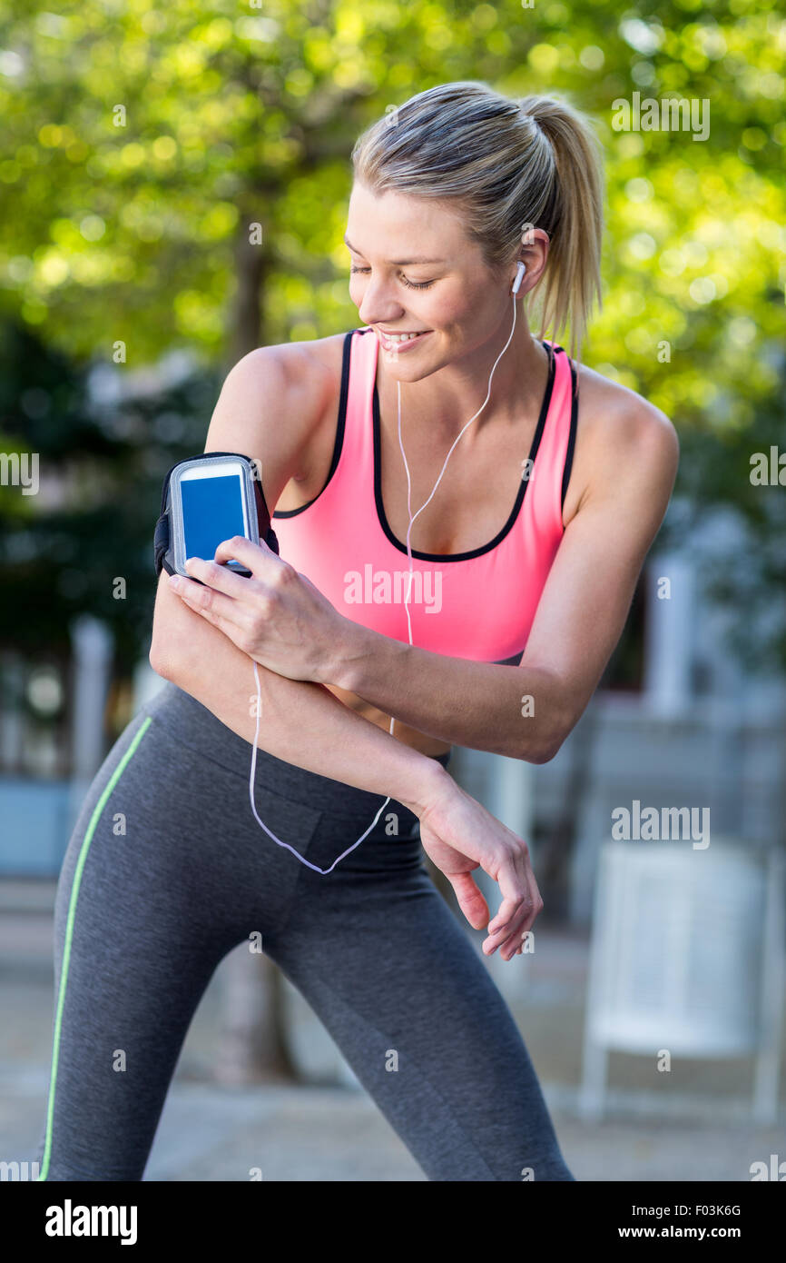 A beautiful athlete using her phone Stock Photo - Alamy