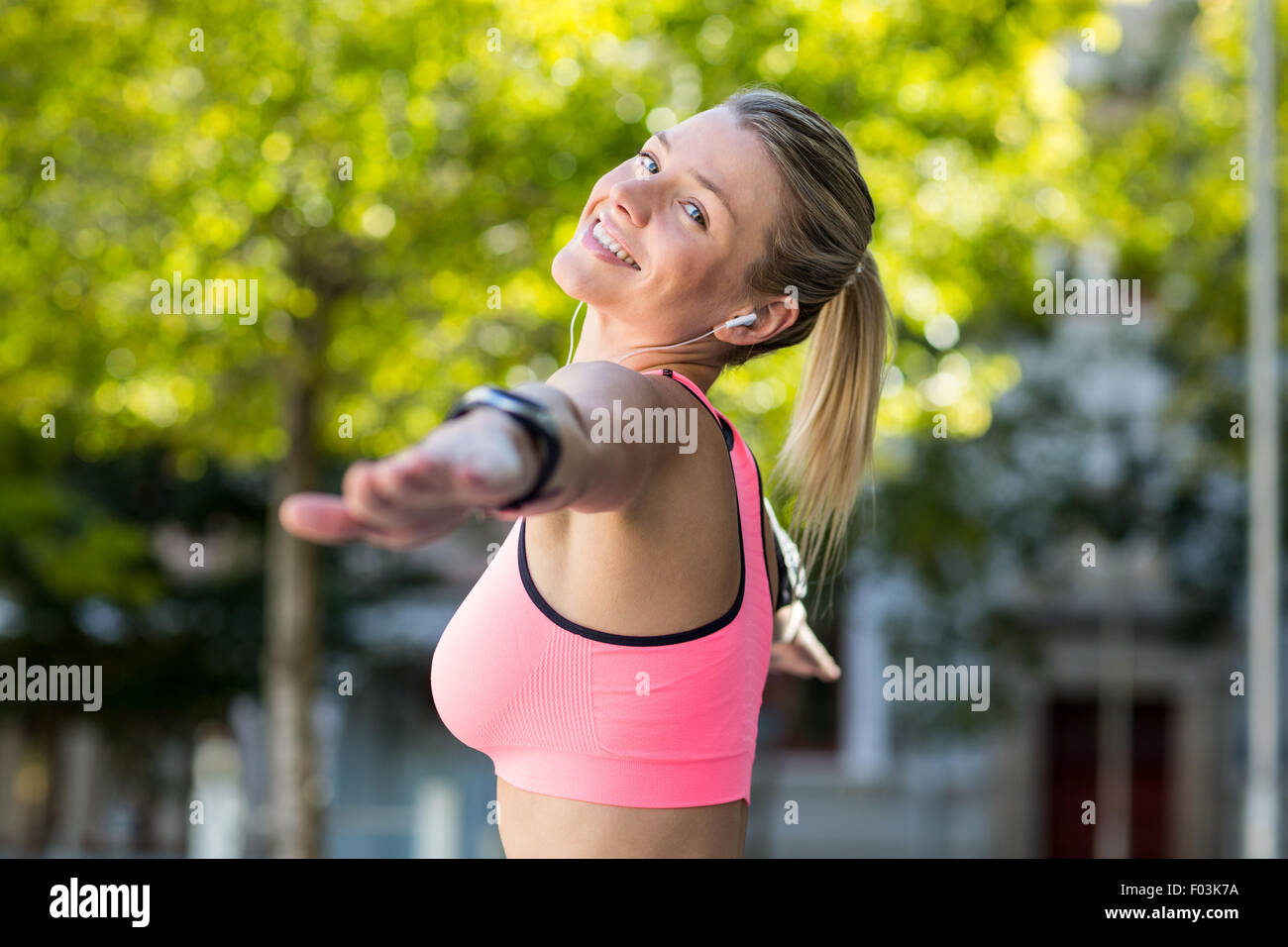 A beautiful athlete stretching her arms Stock Photo - Alamy
