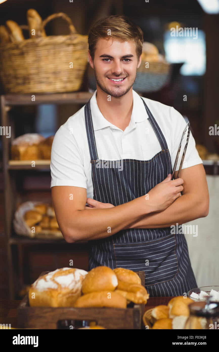 Handsome waiter with arms crossed Stock Photo - Alamy