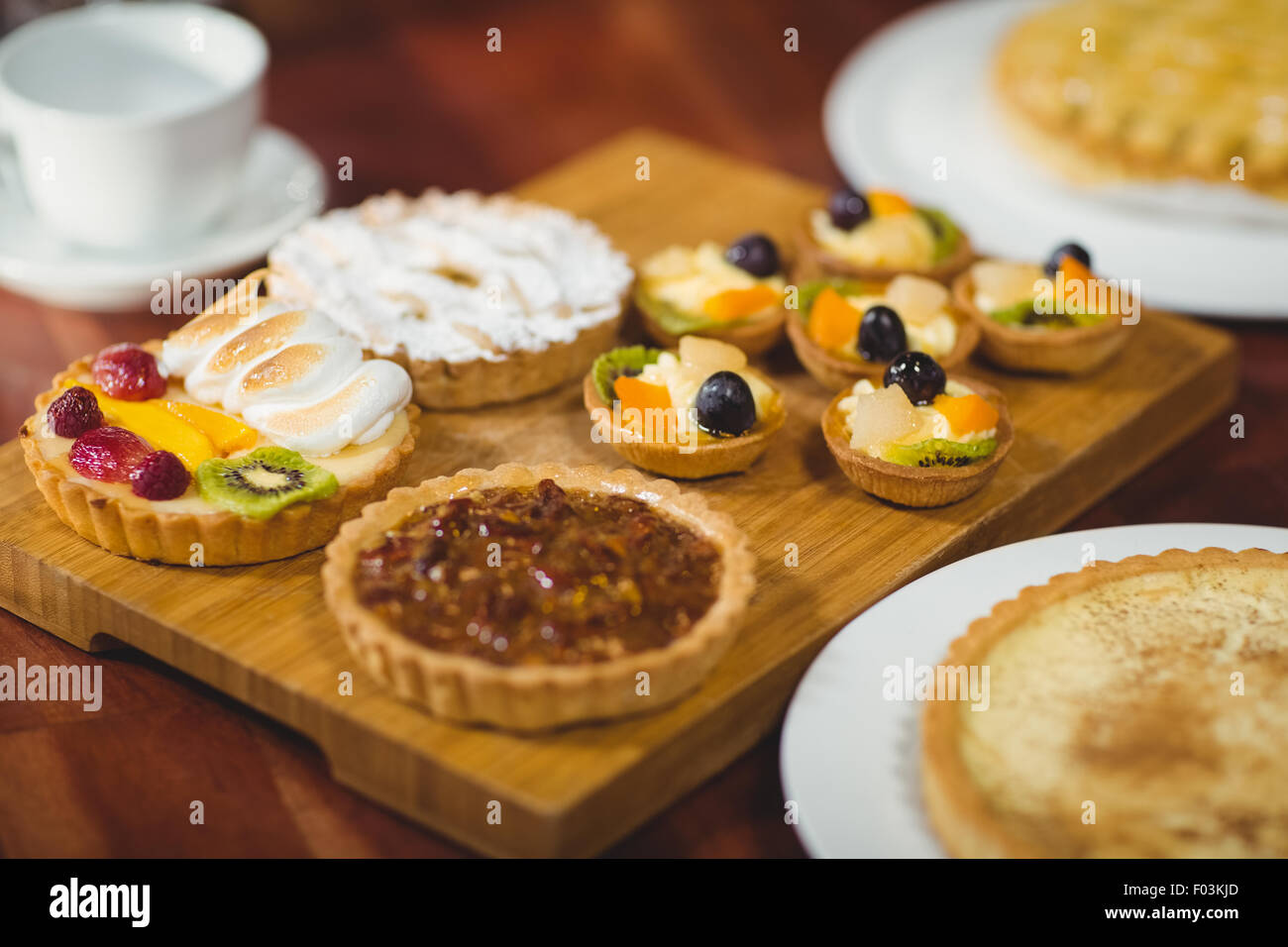 Close up wooden tray of tasty pastries Stock Photo - Alamy