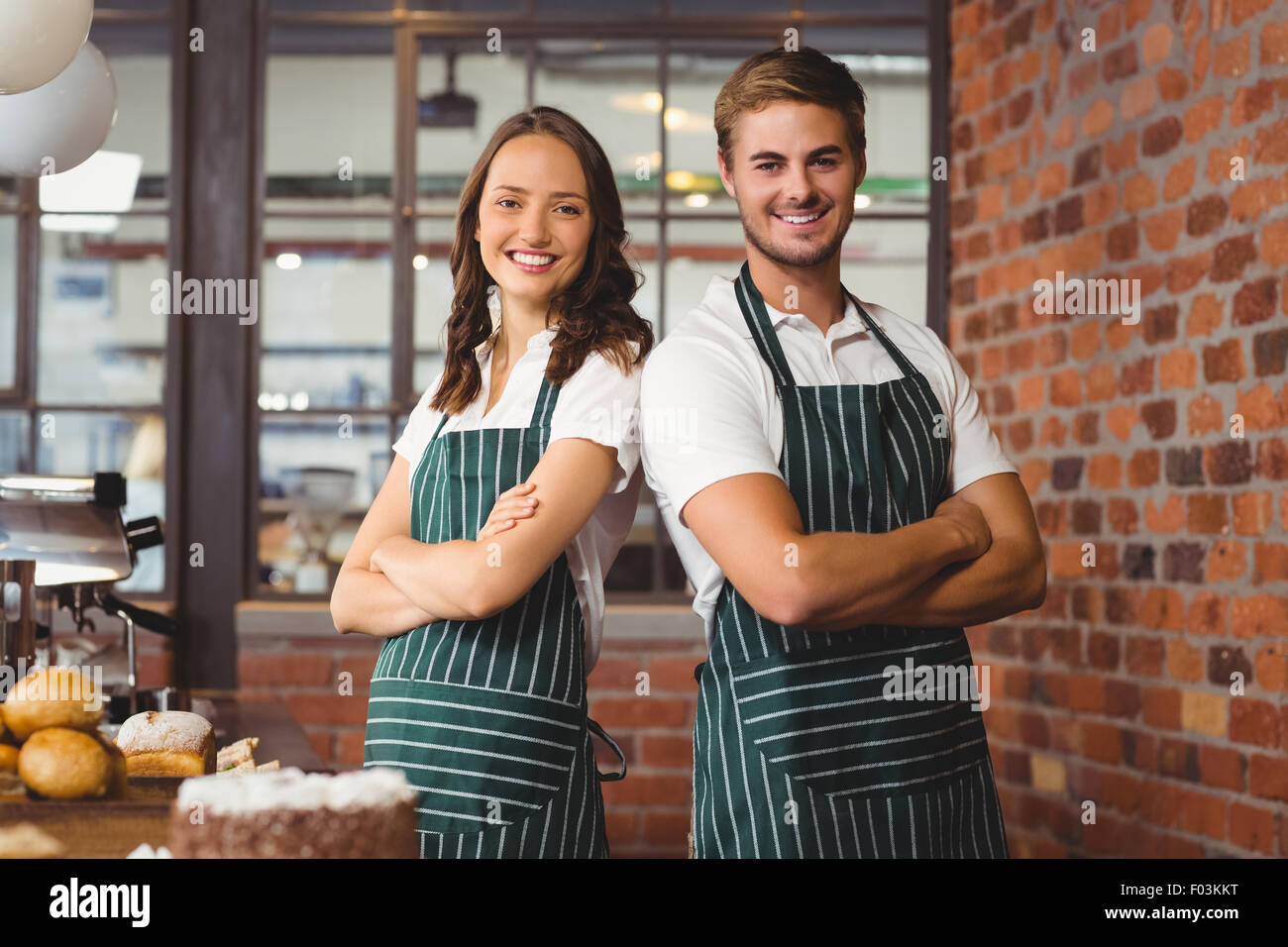 Smiling co-workers standing together Stock Photo - Alamy
