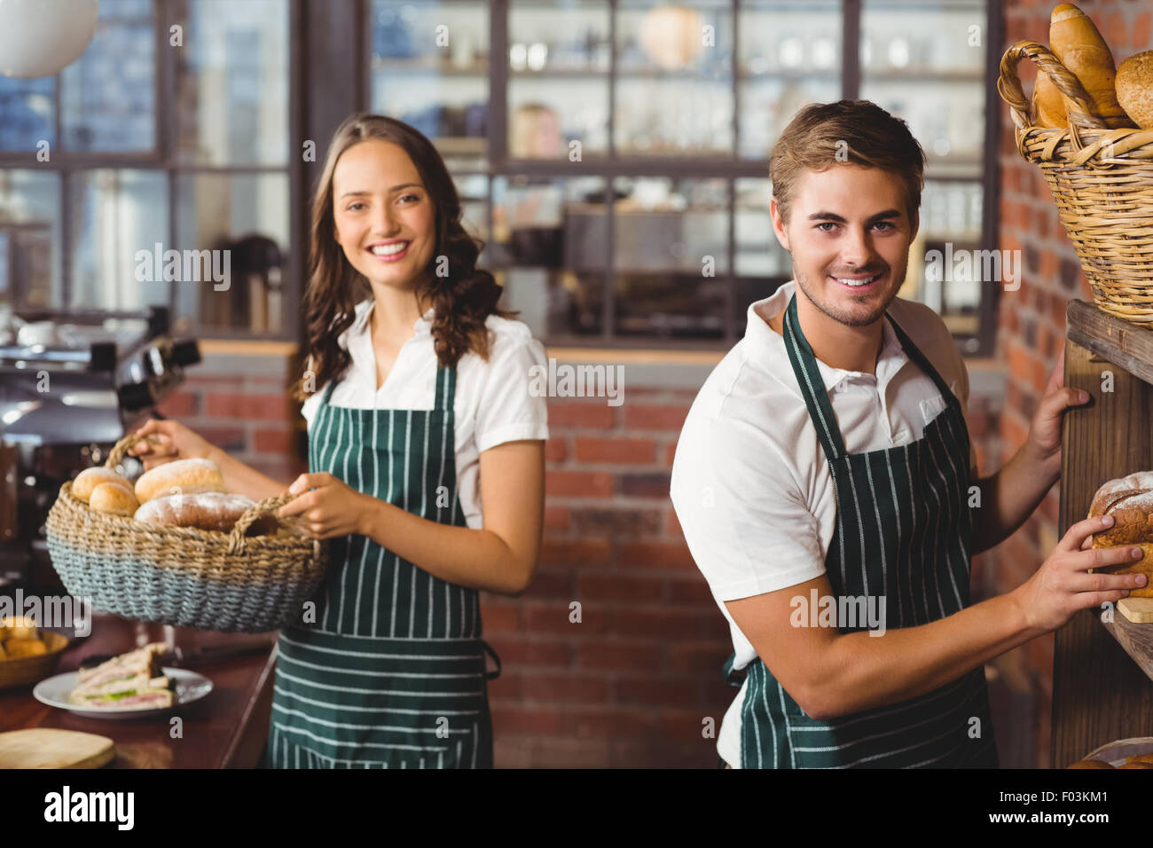 Happy co-workers working with a smile Stock Photo - Alamy