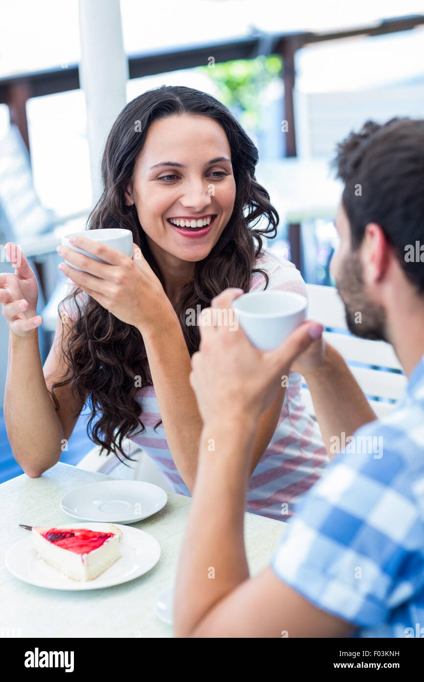 Cute couple having coffee together Stock Photo - Alamy