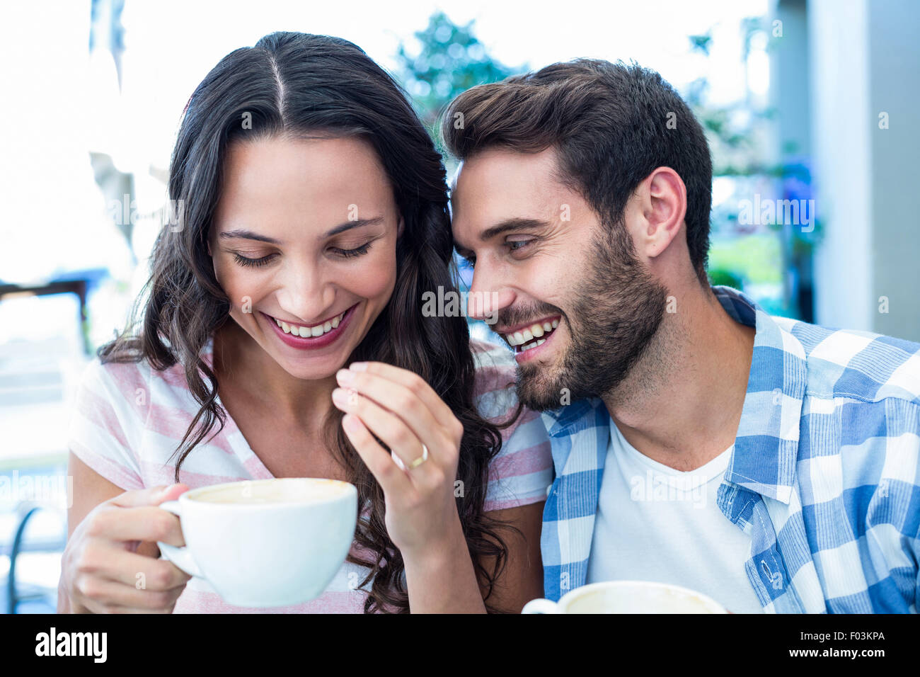 Cute couple having coffee together Stock Photo - Alamy