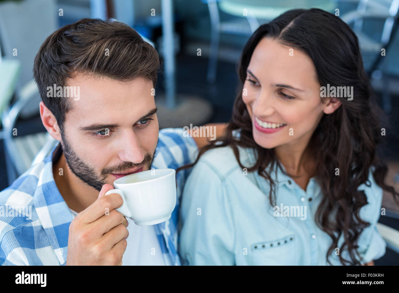 Cute couple having coffee together Stock Photo - Alamy
