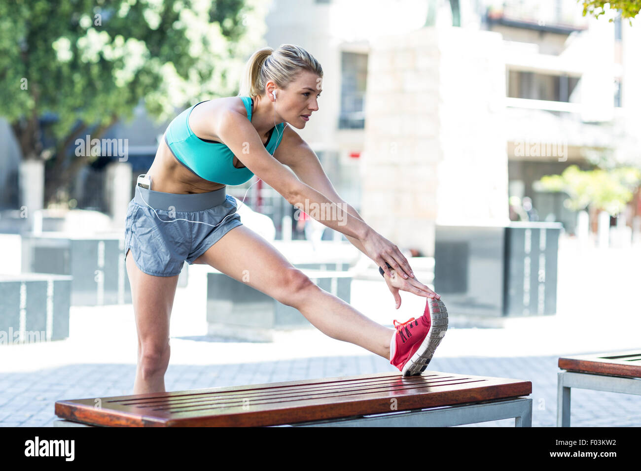 A beautiful woman stretching her leg Stock Photo - Alamy