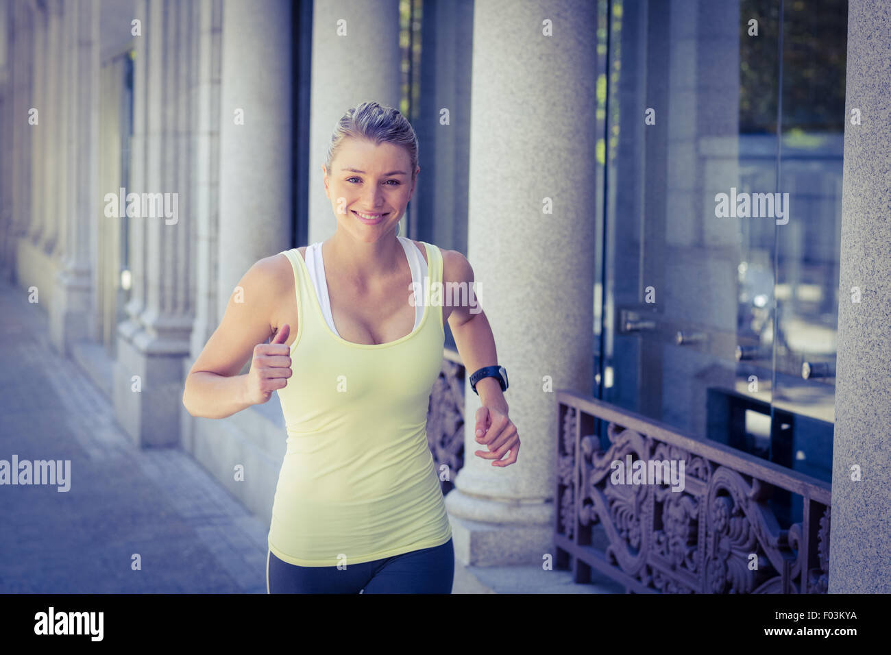 A beautiful woman running in the street Stock Photo - Alamy