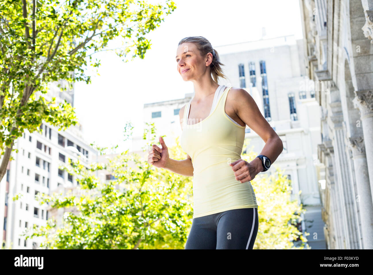 A pretty woman running in the street Stock Photo - Alamy