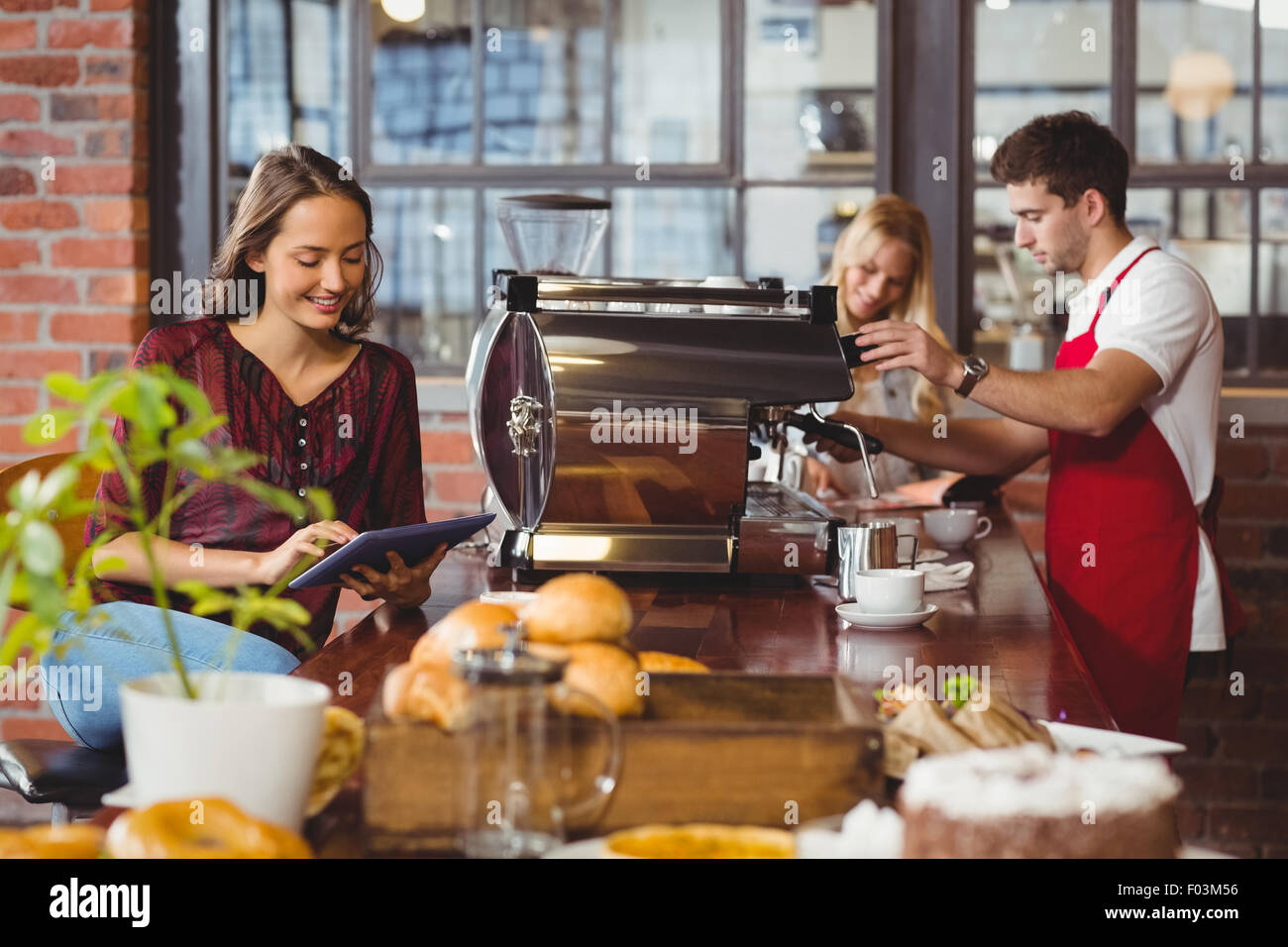 Handsome barista preparing a cup of coffee Stock Photo - Alamy