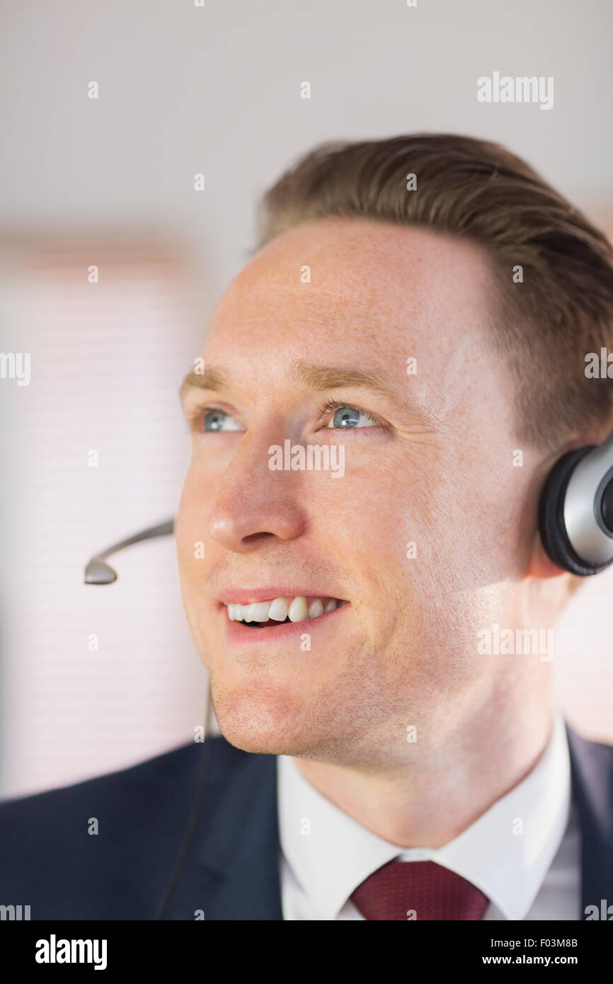 Happy call center agent working Stock Photo - Alamy