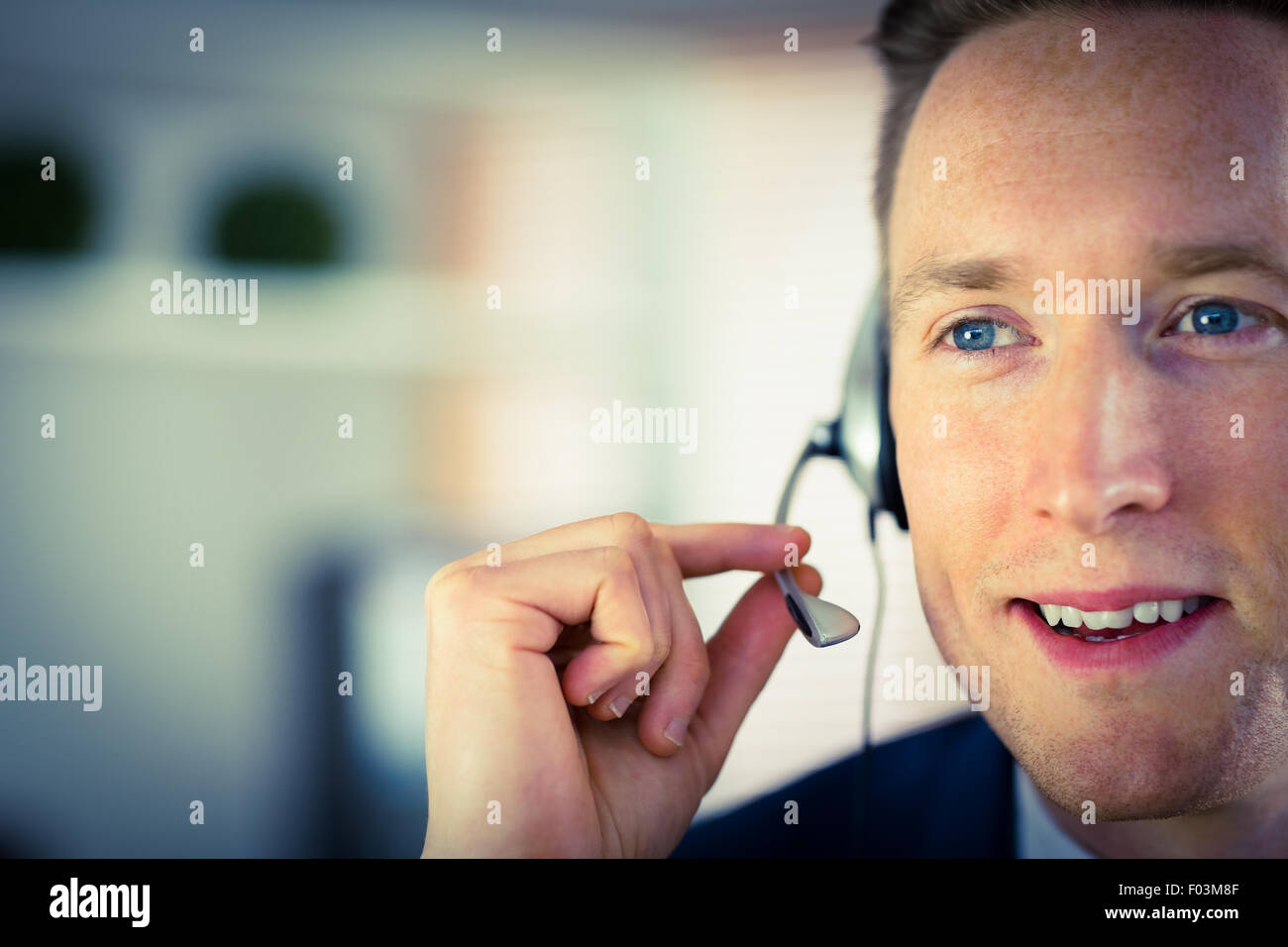 Happy call center agent working Stock Photo - Alamy