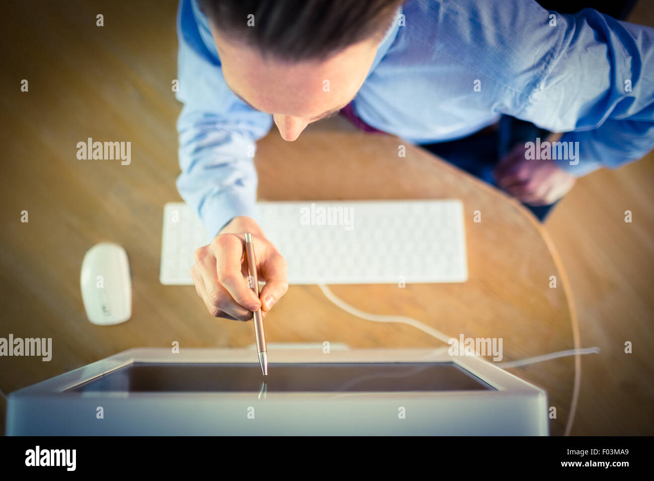 Man pointing pen sitting hi-res stock photography and images - Alamy