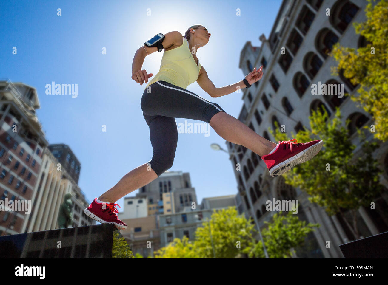 A beautiful woman jumping in the street Stock Photo - Alamy