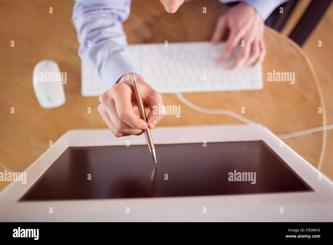 Man pointing pen sitting hi-res stock photography and images - Alamy