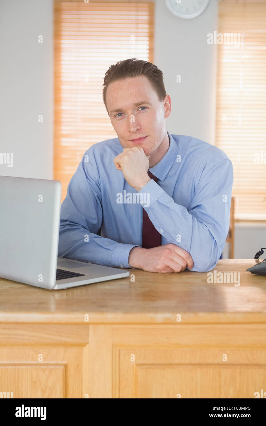 Happy businessman sitting at his desk Stock Photo - Alamy Happy businessman sitting at his desk Stock Photo - Alamy