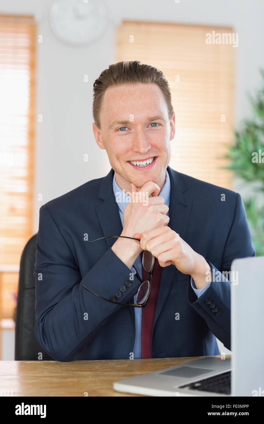 Happy businessman sitting at his desk Stock Photo - Alamy Happy businessman sitting at his desk Stock Photo - Alamy