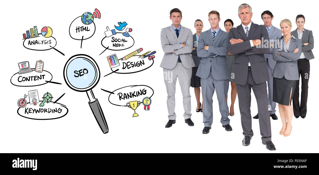 Composite image of business team standing arms crossed Stock Photo - Alamy