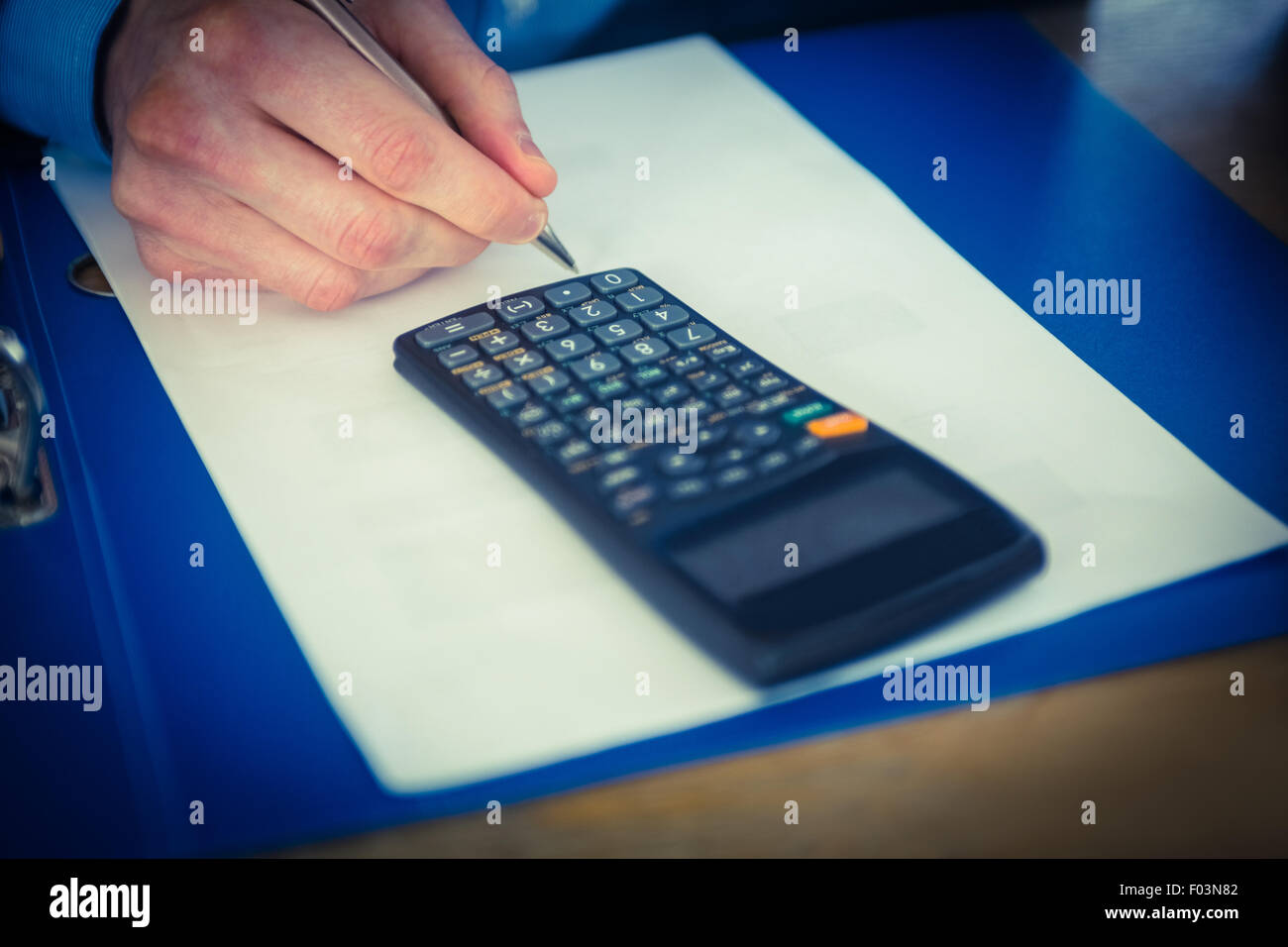 Using a calculator hi-res stock photography and images - Alamy