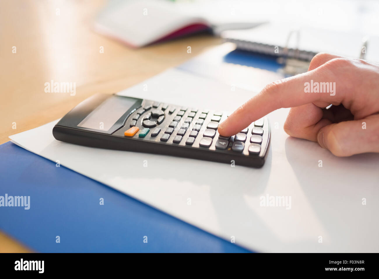 Businessman working on calculator hi-res stock photography and images ...
