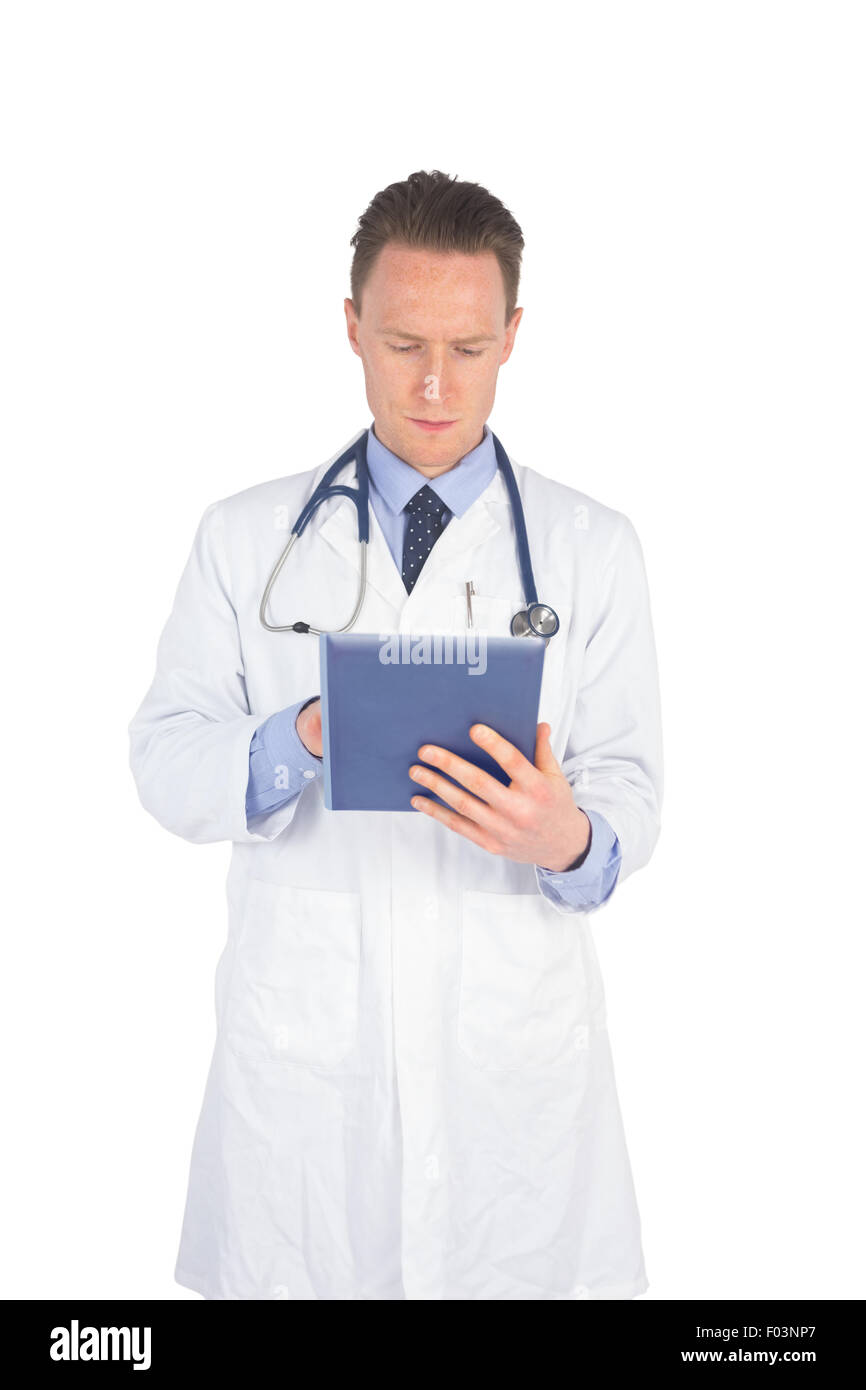 Serious doctor using touchscreen hi-res stock photography and images ...