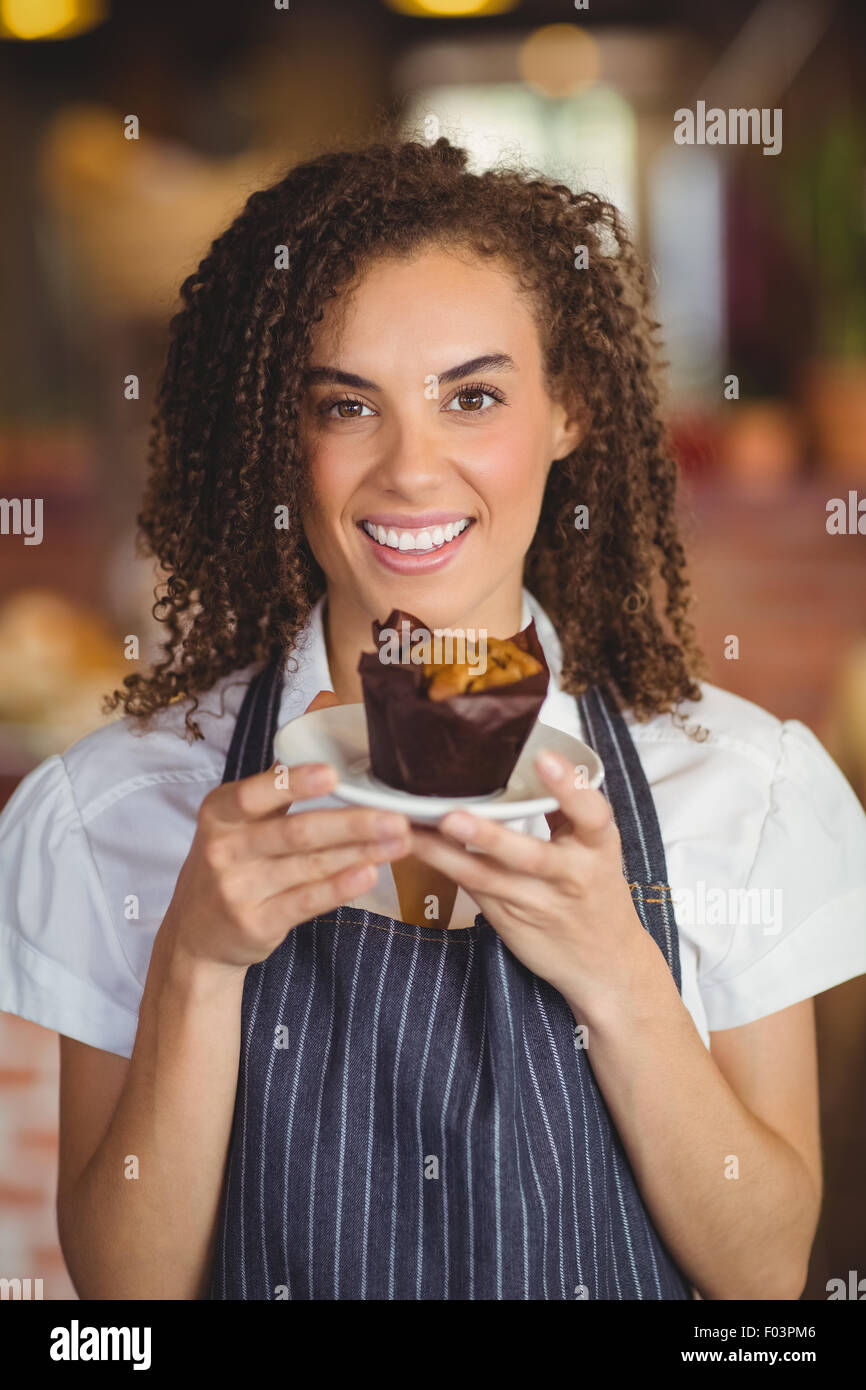 Woman holding muffin showing hi-res stock photography and images - Alamy