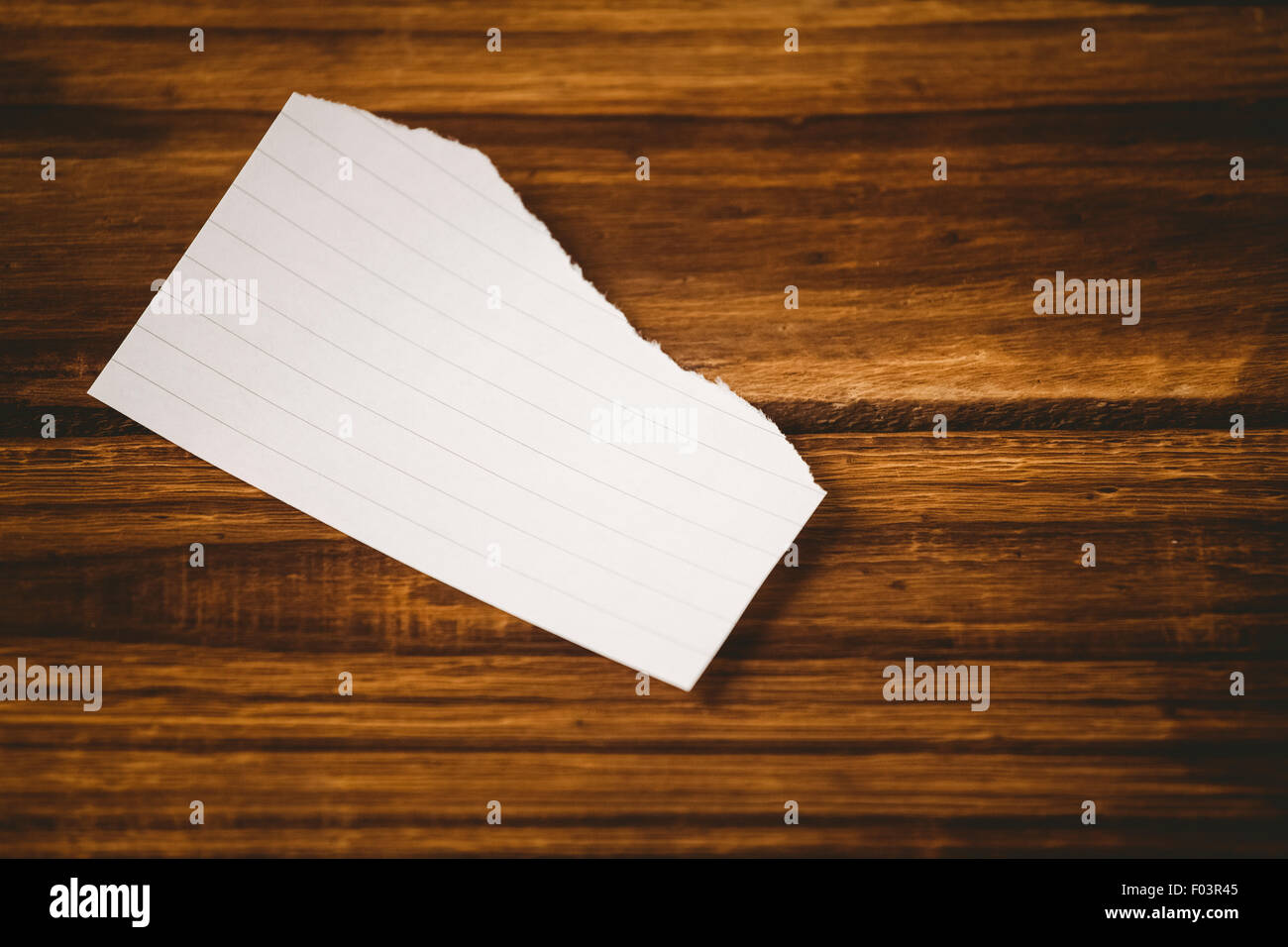 Scrap of paper on wooden table Stock Photo - Alamy