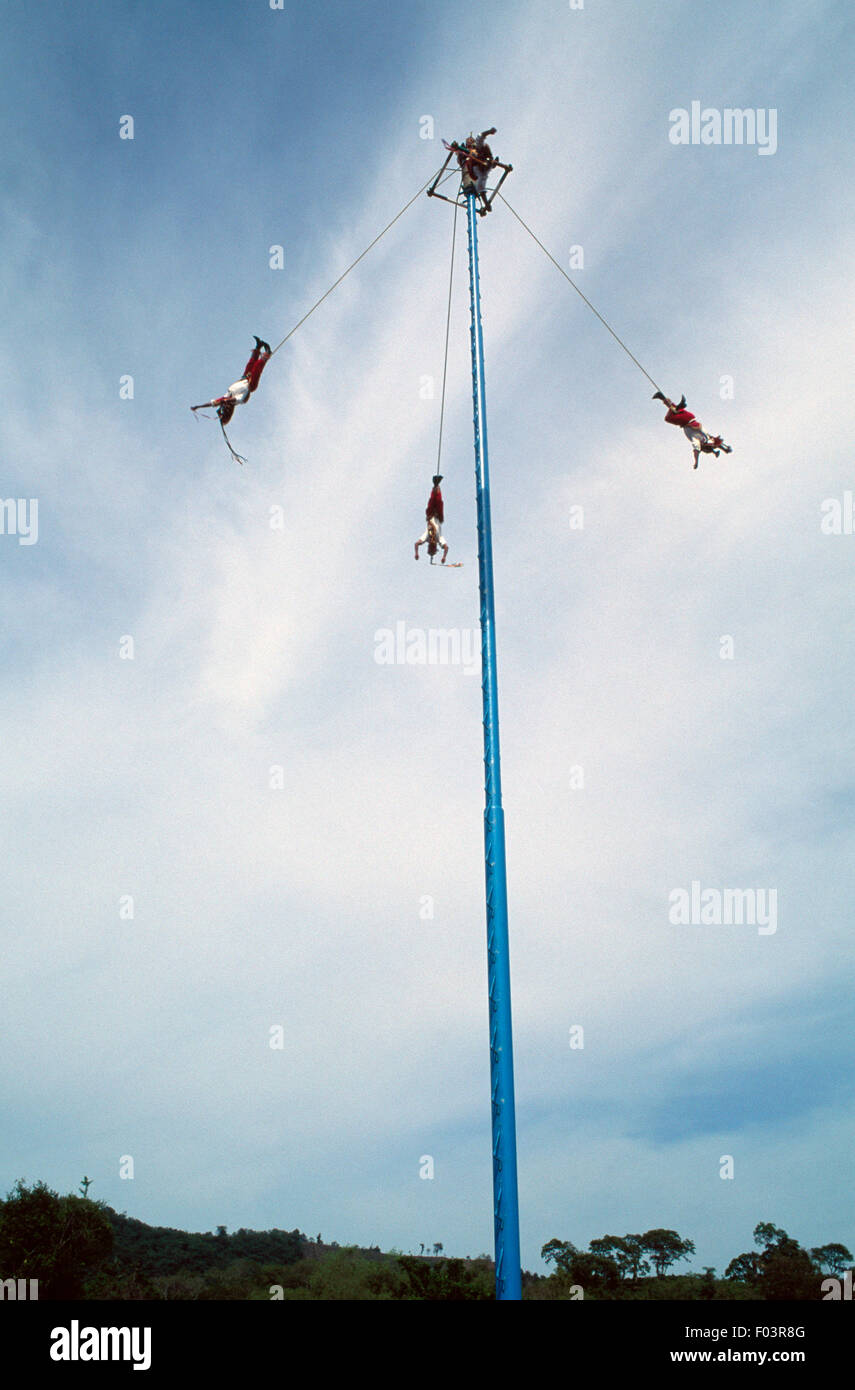 Voladores (flying men) launching themselves from the platform atop the ...