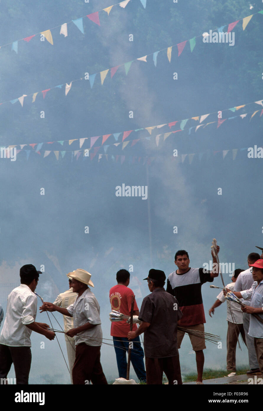 Men setting off fireworks during the Festival of the Birth of the ...