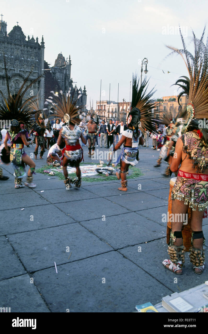 Dancers in Aztec costumes performing in the Zocalo (Constitution Square ...