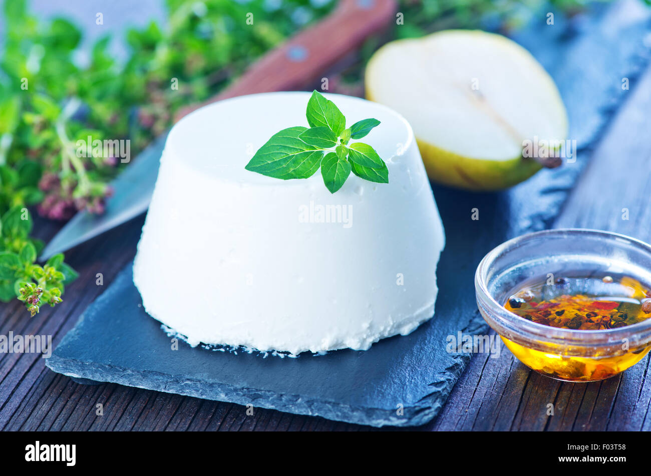 ricotta cheese with fresh pear on a table Stock Photo - Alamy
