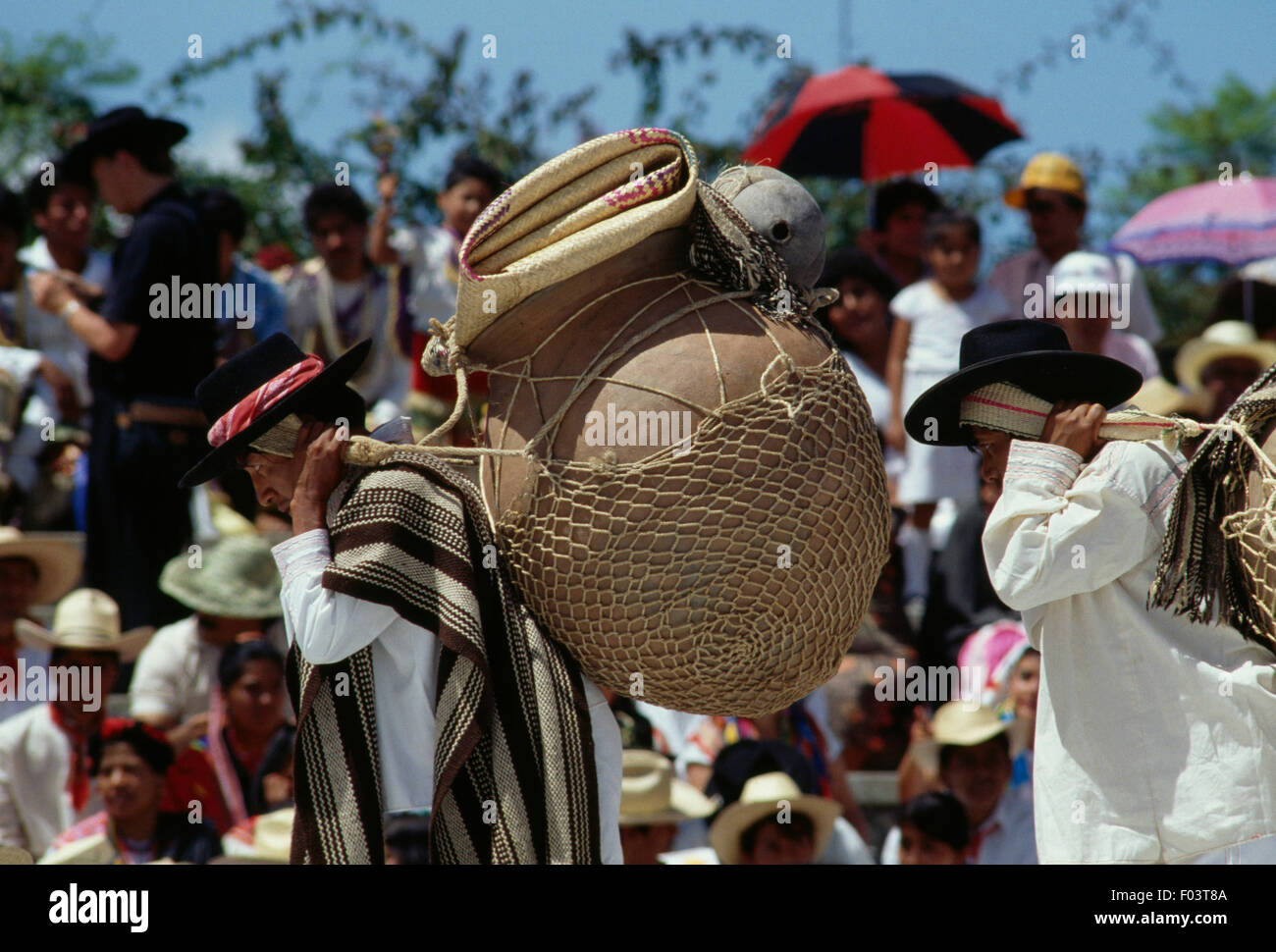 Man with large orci (vessel) strapped on his back during a dance for ...