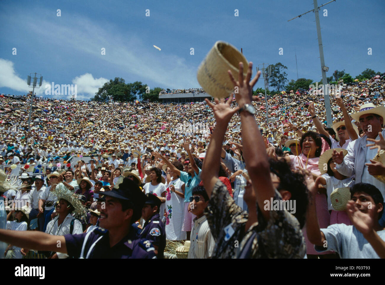 Throwing gifts to the public during the celebrations at the Guelaguetza ...