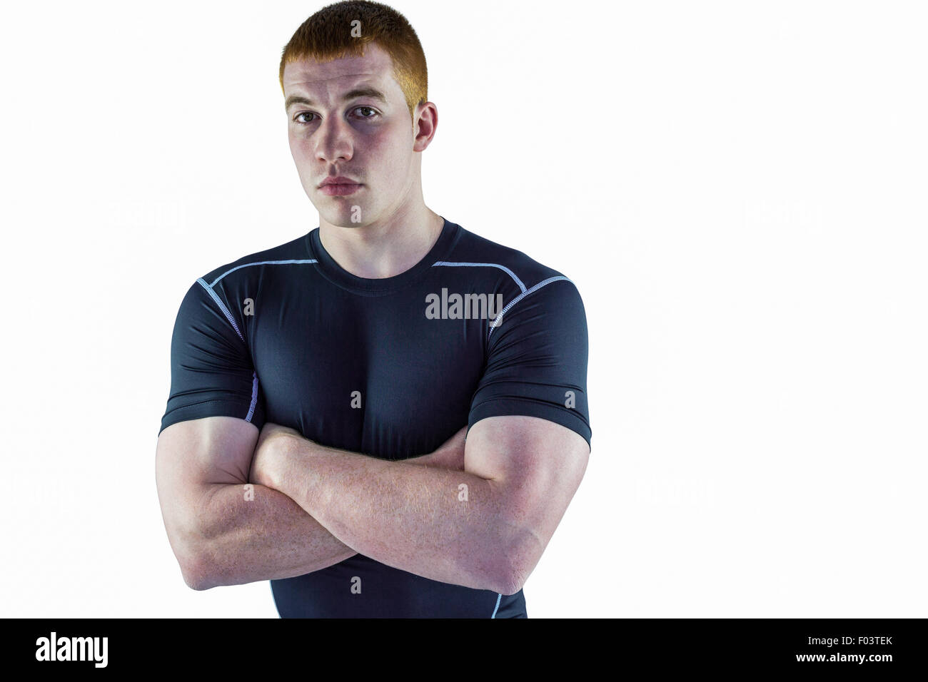 Muscular rugby player with arms crossed Stock Photo - Alamy