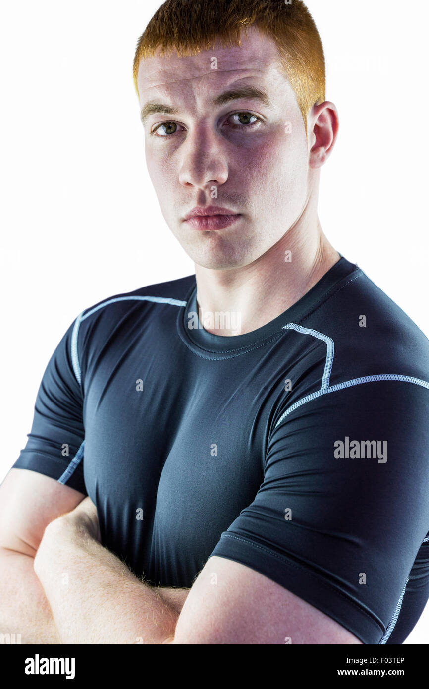 Muscular rugby player with arms crossed Stock Photo - Alamy