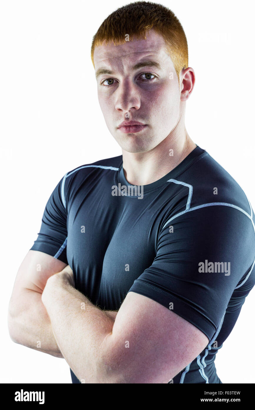 Muscular rugby player with arms crossed Stock Photo - Alamy