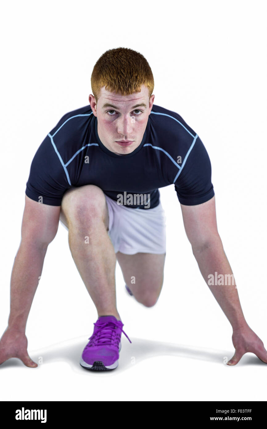 Muscular rugby player in running stance Stock Photo - Alamy