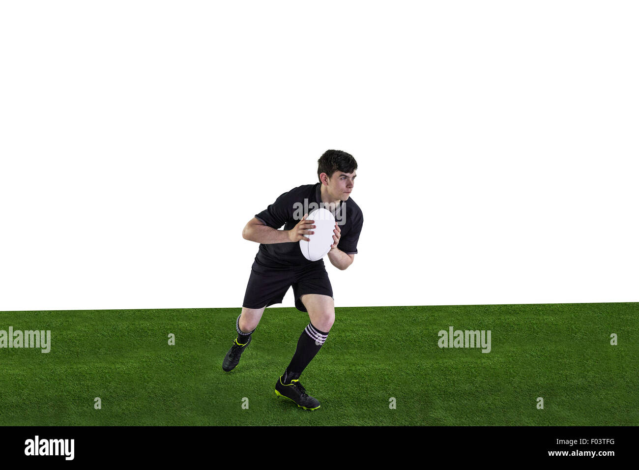 Rugby player running with the rugby ball Stock Photo - Alamy