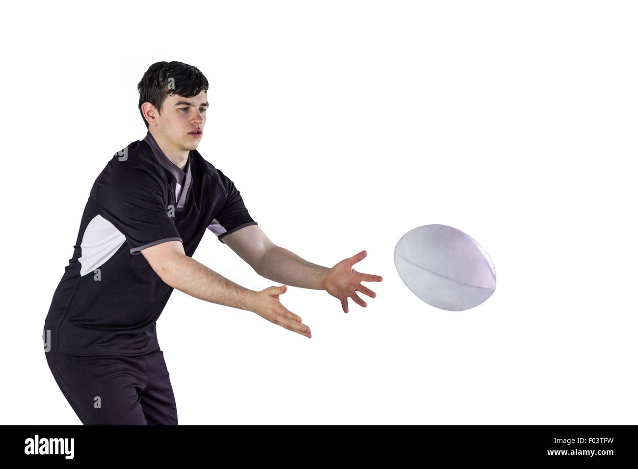 Rugby player throwing a rugby ball Stock Photo - Alamy