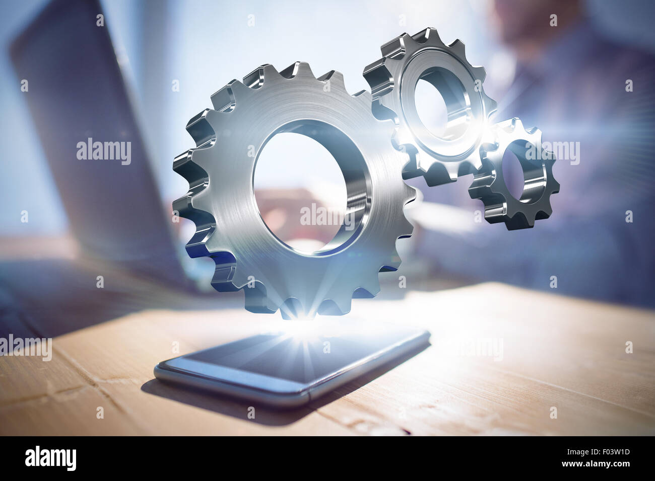 Composite image of metal cog and wheel connecting Stock Photo - Alamy